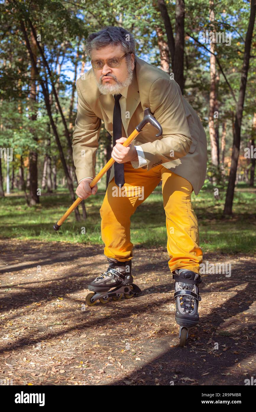 Elderly man rollerskating hi-res stock photography and images - Alamy