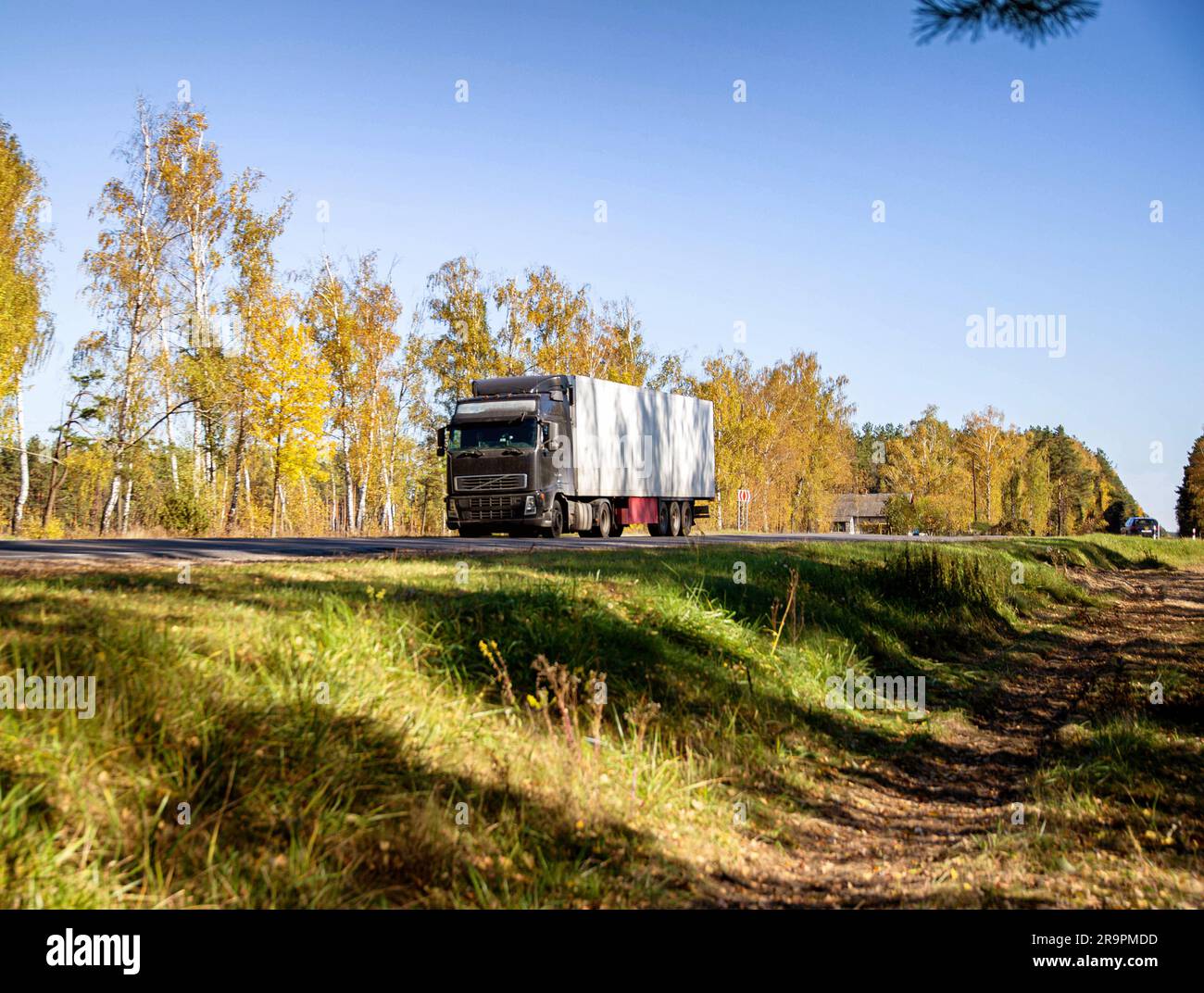 A truck with a refrigerated semi-trailer transports perishable goods ...