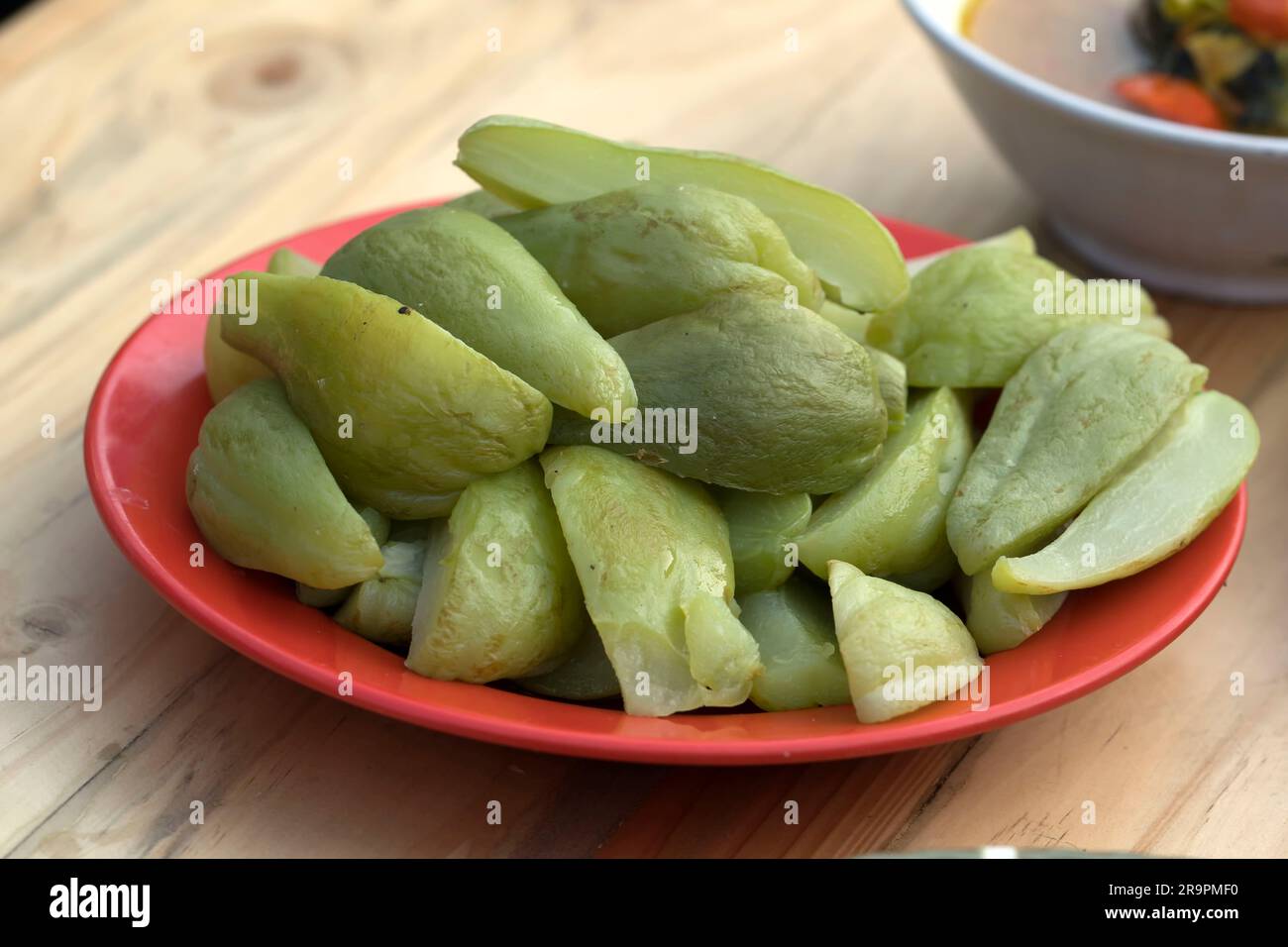 Cut boiled chayote served on a red plate. Food Photography Stock Photo ...
