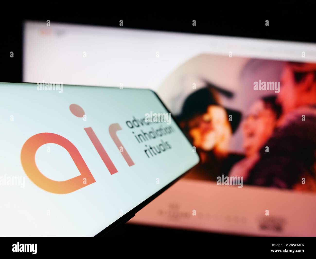 Smartphone with logo of company AIR Limited (Advanced Inhalation Rituals) on screen in front of ...