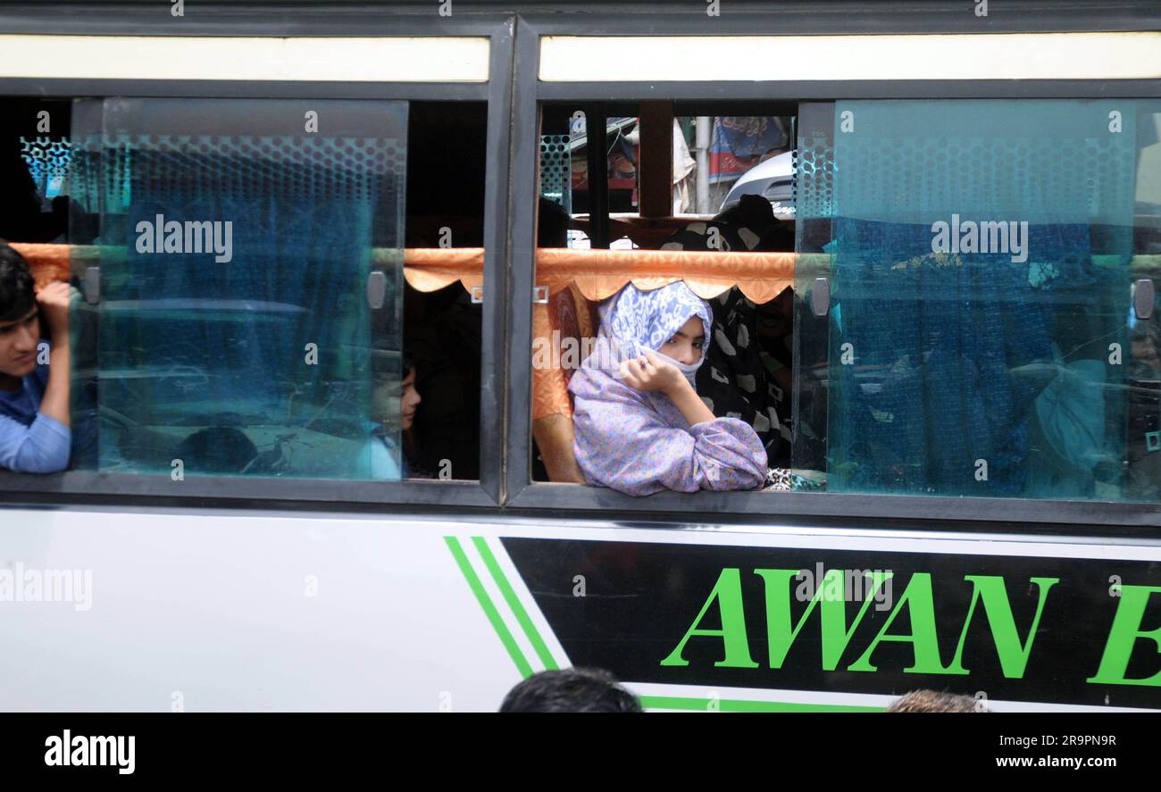 Rawalpindi Pakistan, Pakistan. 28th June, 2023. People gather at a bus ...