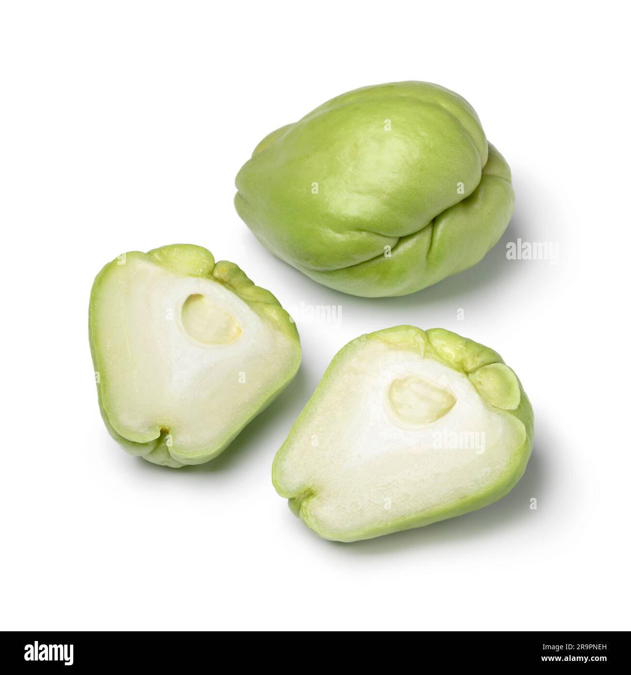 Whole and halved fresh chayote isolated on white background close up ...