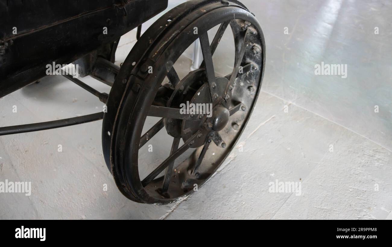 Metal wheel of the first created tractor, close-up. Retro tractor Stock ...