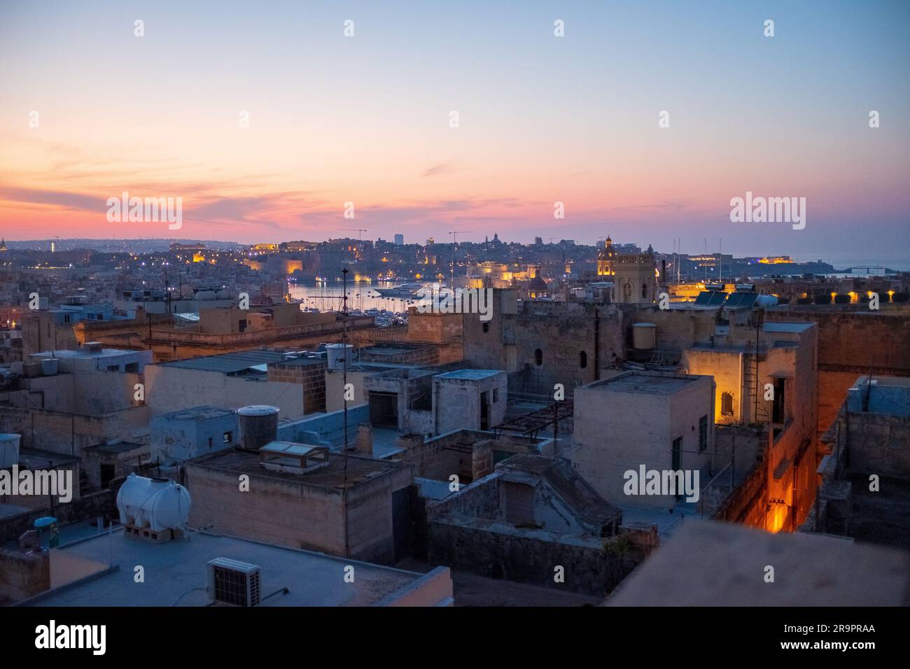 A sunset view of the city of Valetta, from Bormla in Malta Stock Photo ...