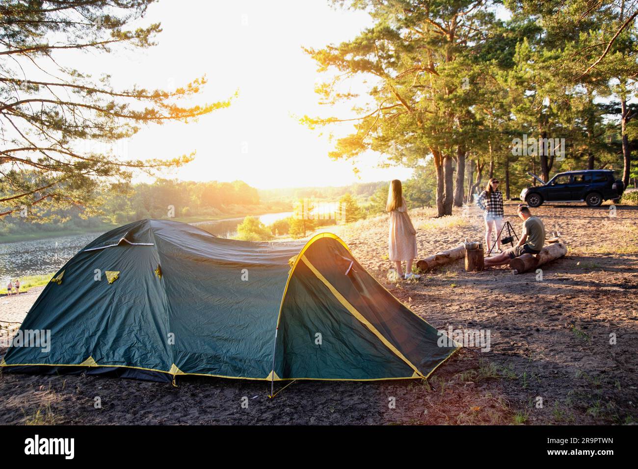 Tourist tent in a picturesque place on the banks of the river against ...
