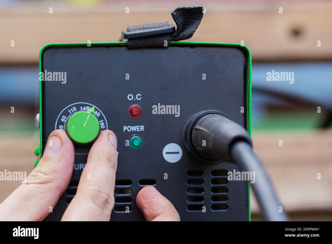 Adjusting the current strength on a modern welding machine. Welding arc ...