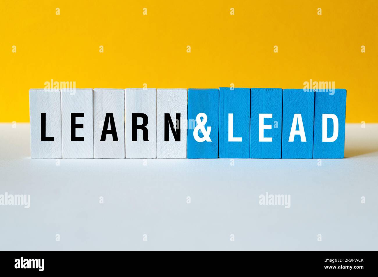 Learn and lead - word concept on building blocks, text, letters Stock ...