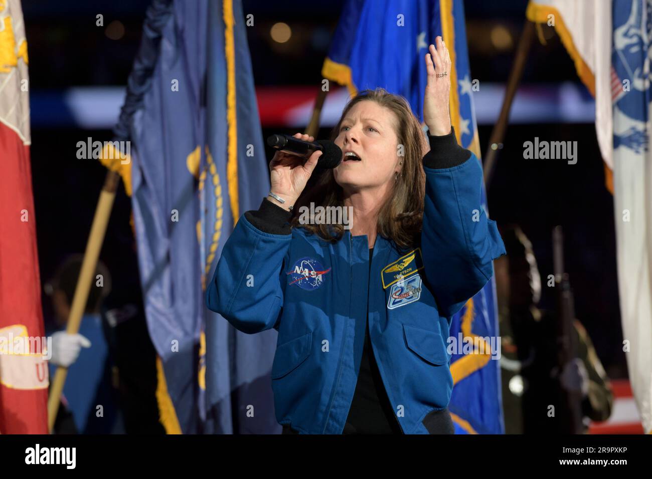NASA astronaut Tracy Caldwell Dyson sings the national anthem before ...