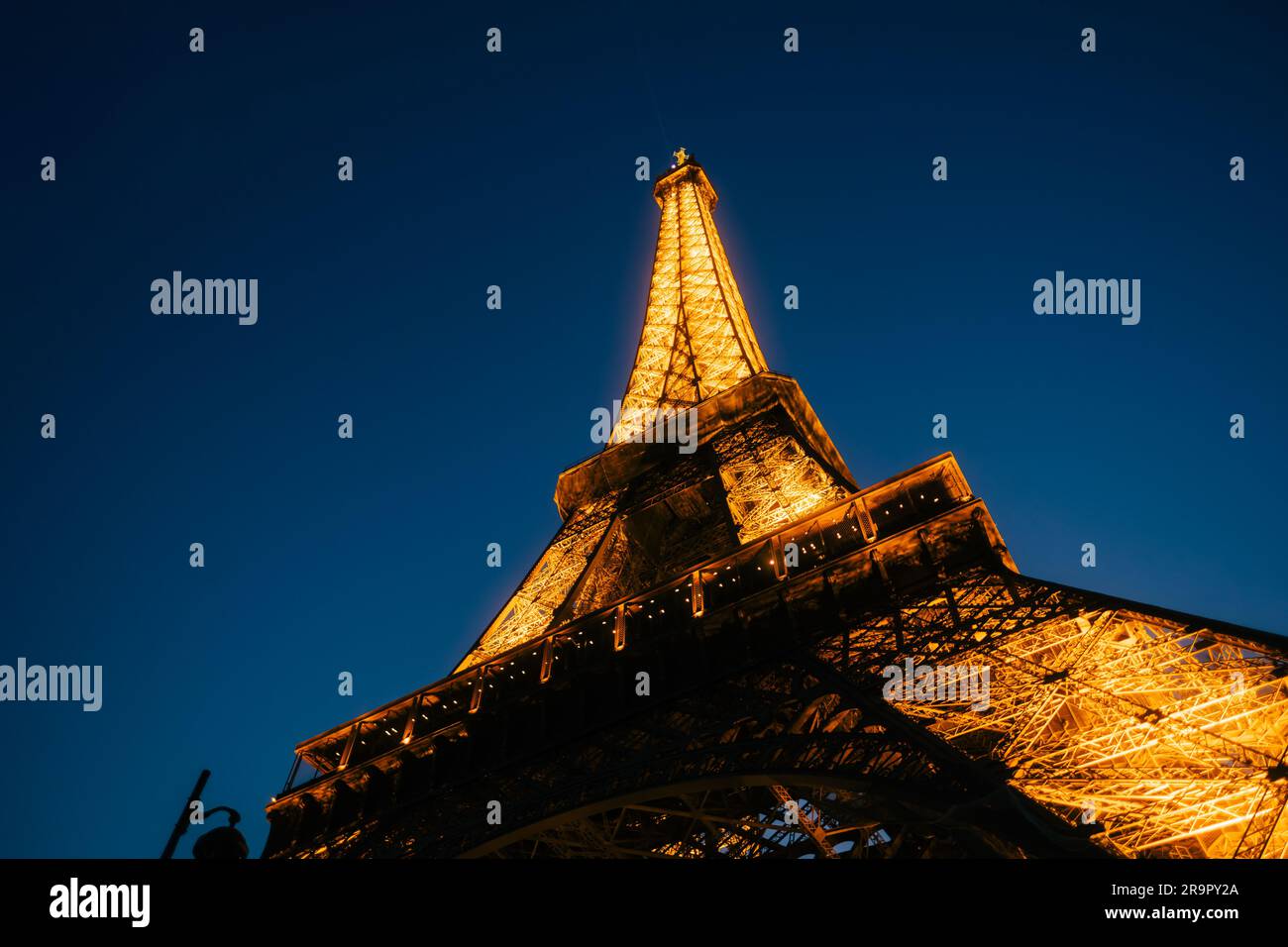 Glowing Eiffel Tower against the sunset sky in Paris, France Stock Photo - Alamy