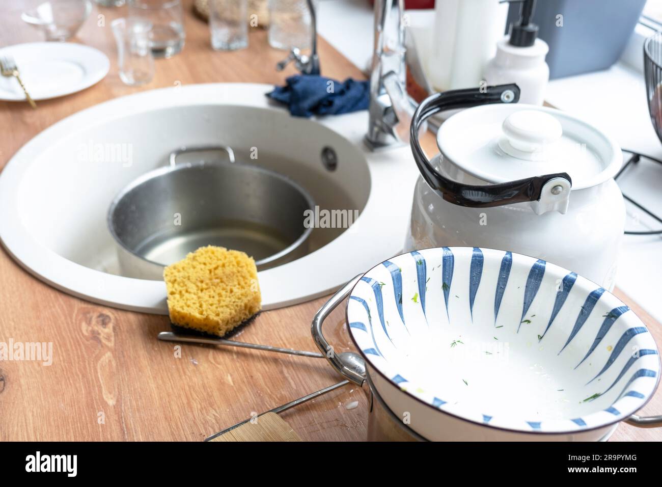 A mess in the kitchen, dirty dishes on the table, scattered things ...