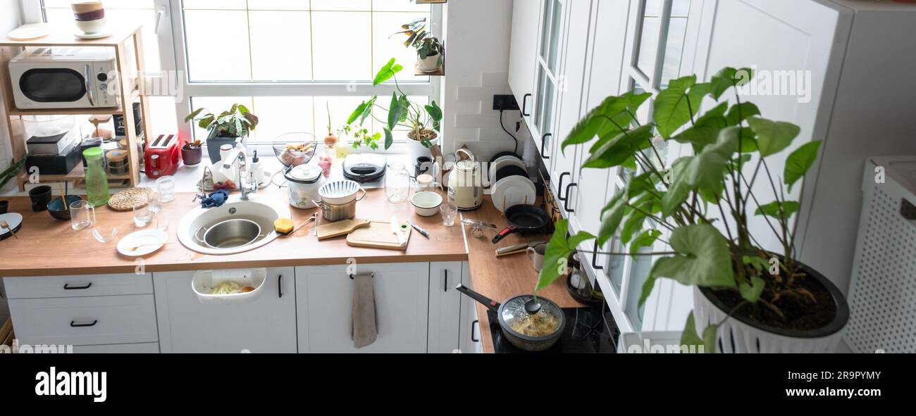 A mess in the kitchen, dirty dishes on the table, scattered things ...