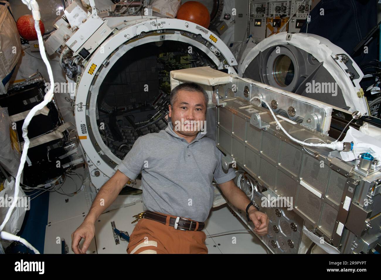 Expedition 68 Flight Engineer Koichi Wakata of JAXA prepares a small ...
