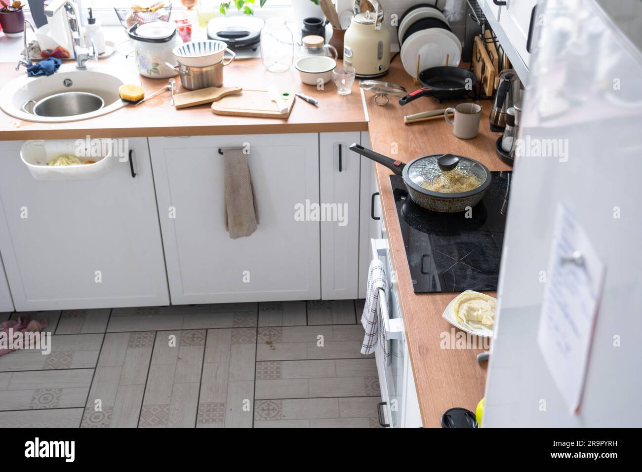 A mess in the kitchen, dirty dishes on the table, scattered things ...