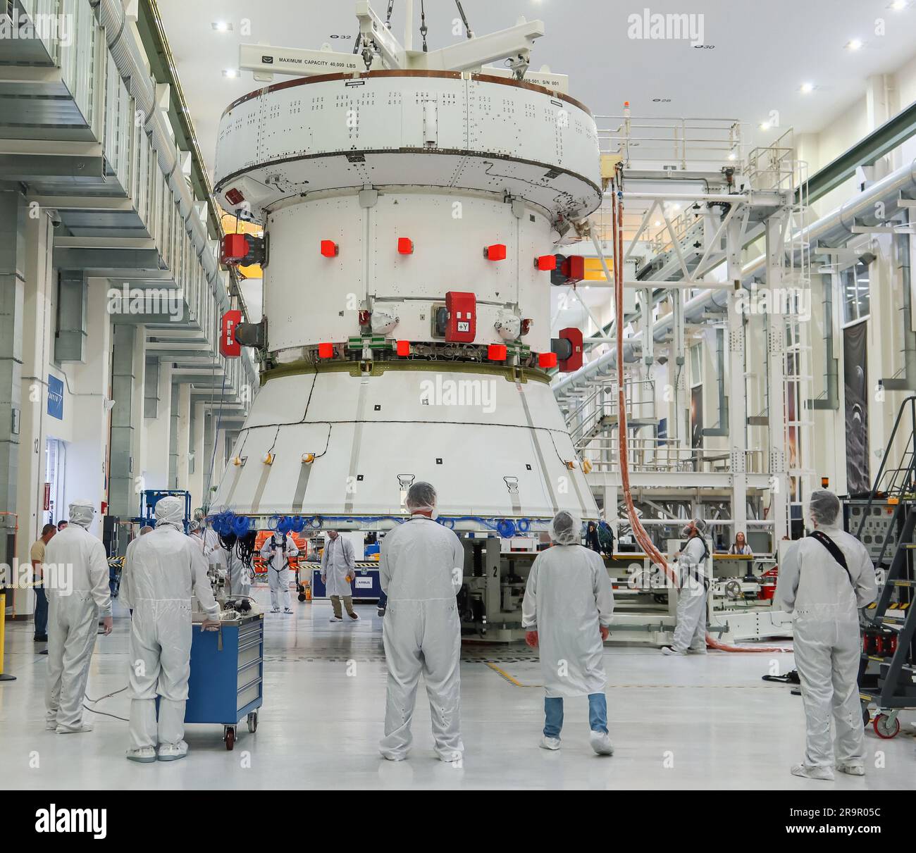 Artemis II SM Move to Fast Cell. Engineers and technicians monitor the progress as the European ...