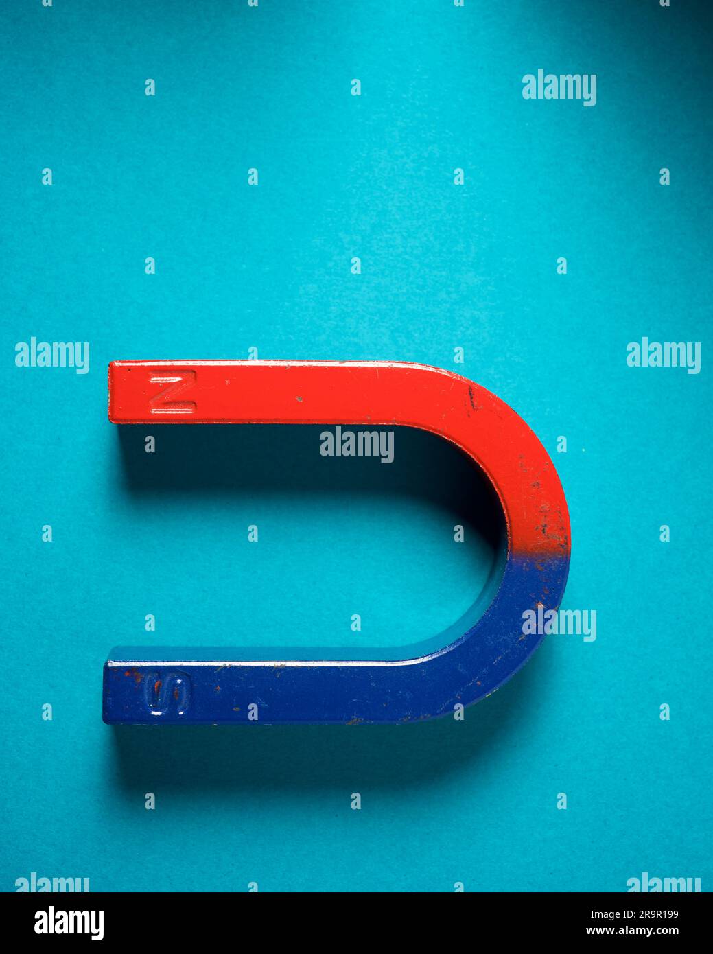 View of a red and blue magnet horseshoe on a green surface Stock Photo ...