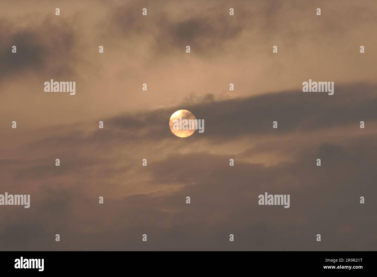 Sky, with diffused sun clouds colourful Stock Photo - Alamy