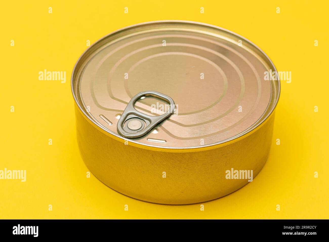 Unopened Tin Can with Blank Edge on Yellow Background. Canned Food ...