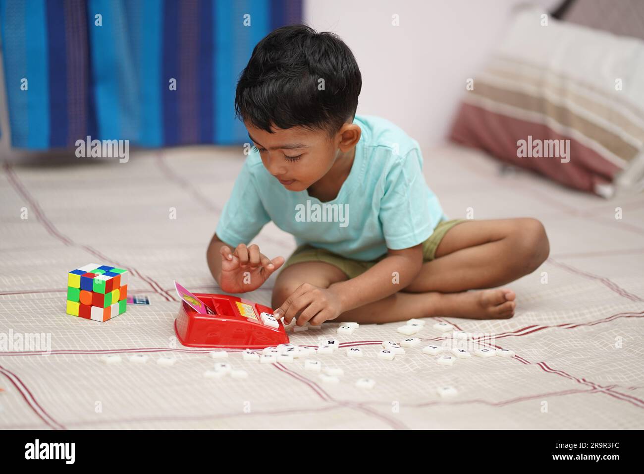 Scrabble board boy hi-res stock photography and images - Alamy
