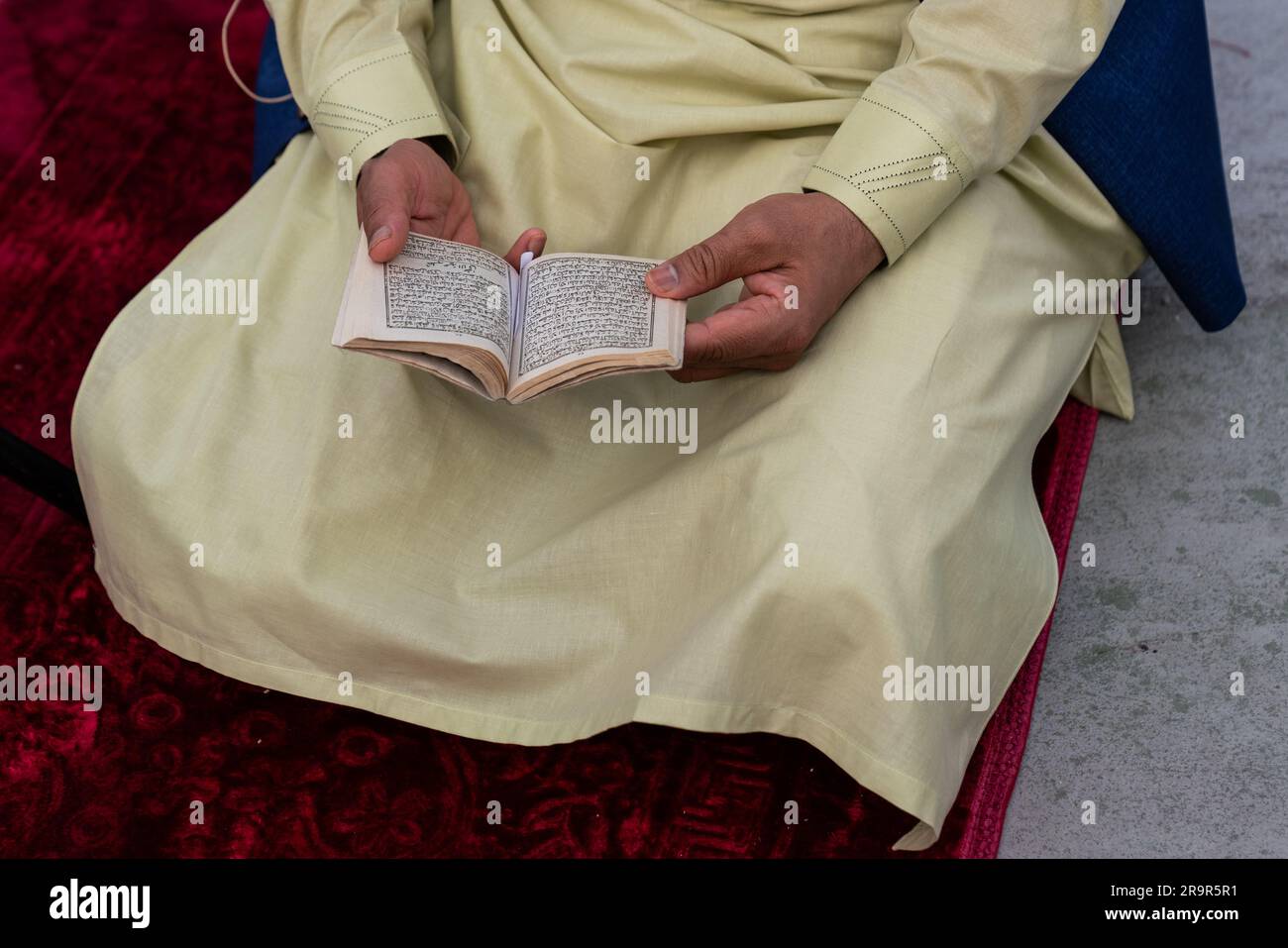Madrid, Spain. 28th June, 2023. Iman praying with the Quran during the ...