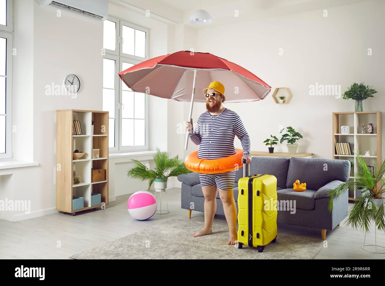 Funny excited chubby man standing at home is finally ready to go on ...