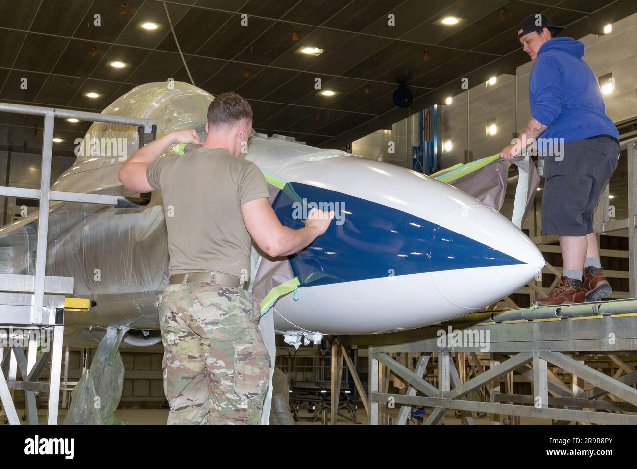 . U.S. Air Force Corrosion Control Facility personnel Kristian Snoots ...