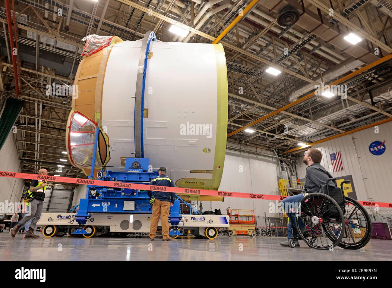 NASA technicians positioned the Artemis II Space Launch System engine ...