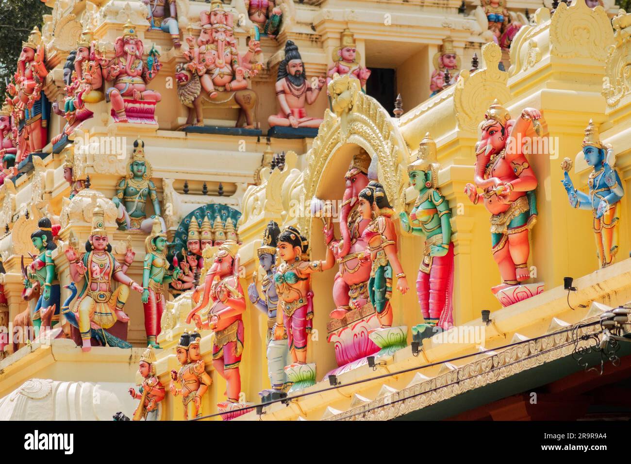 A majestic Hindu temple adorned with intricate figures of deities ...