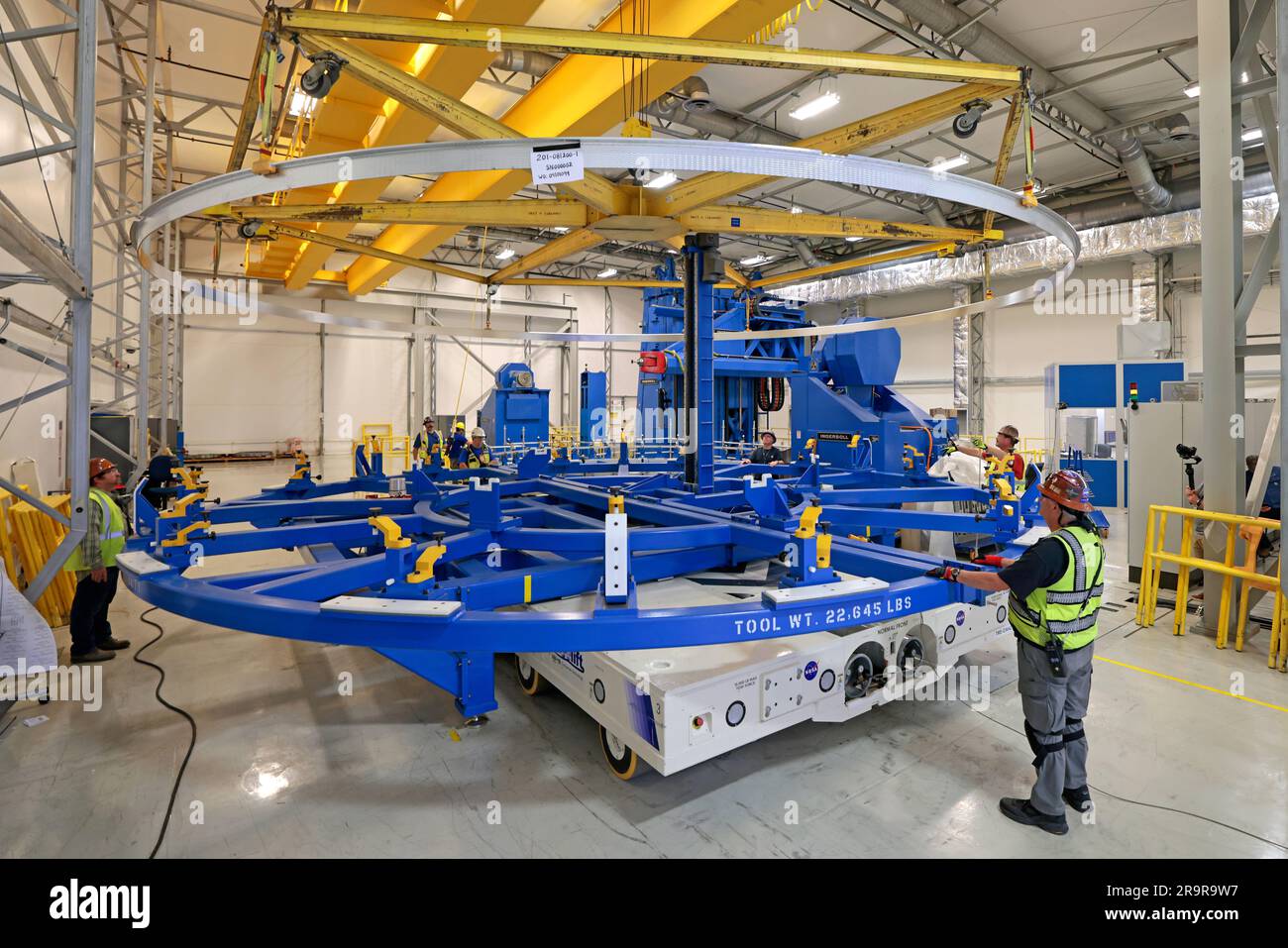 . Technicians at NASA’s Michoud Assembly Facility in New Orleans lift a ...