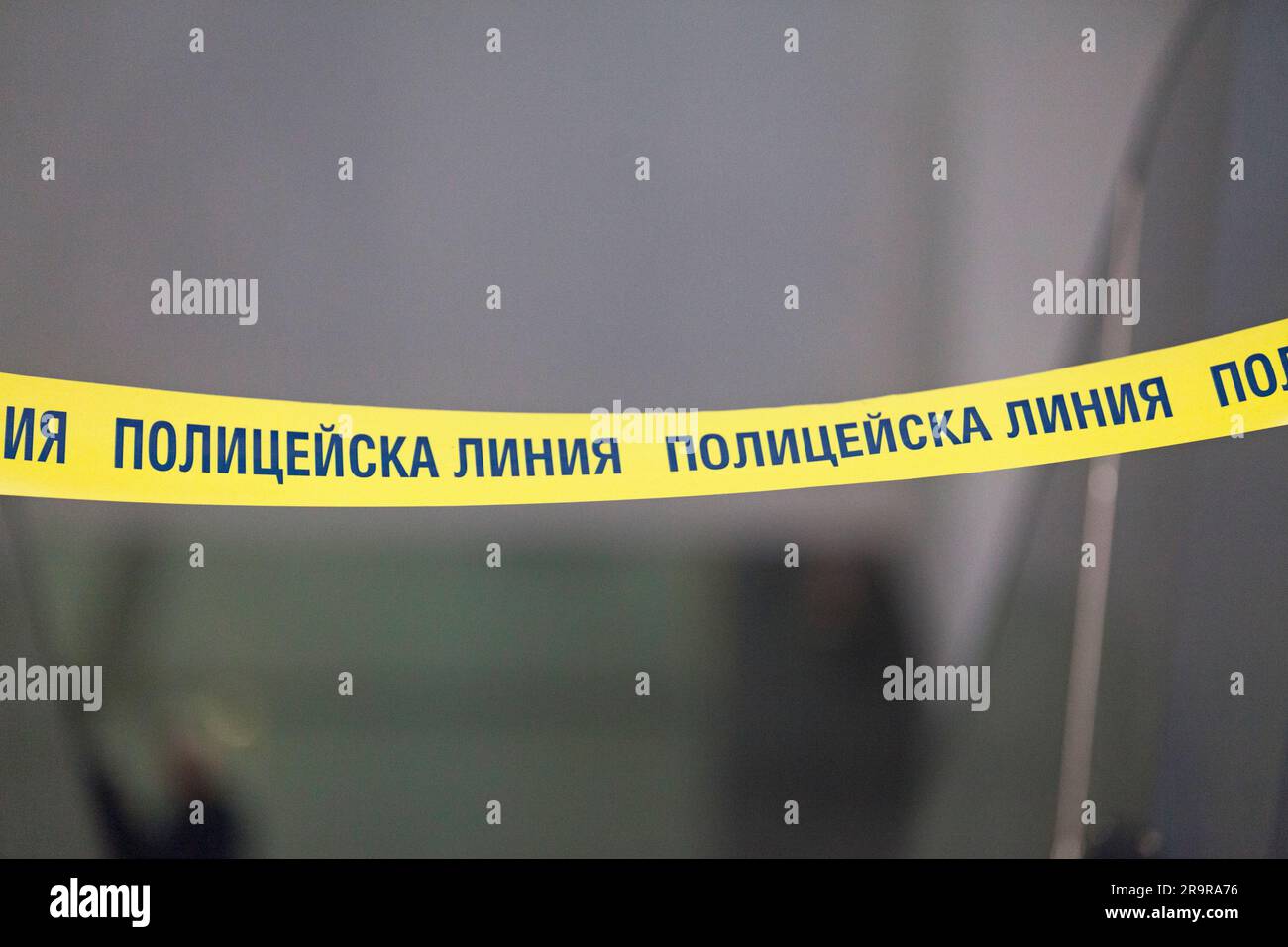 Police tape with written in it in Bulgarian "Полицейска линия", meaning ...