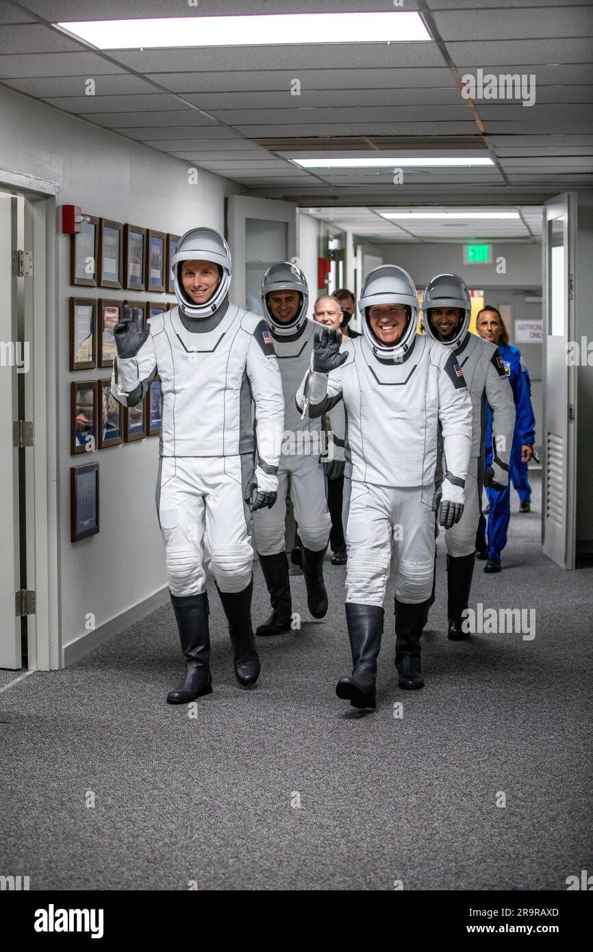 NASA’s Crew-6 astronauts walked from the crew quarters to the elevator ...