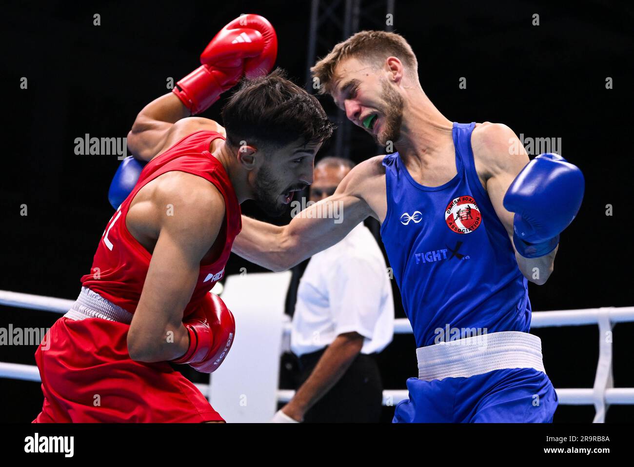 Belgian boxer Vasile Usturoi (in red) and Danish boxer Frederik Lundga ...