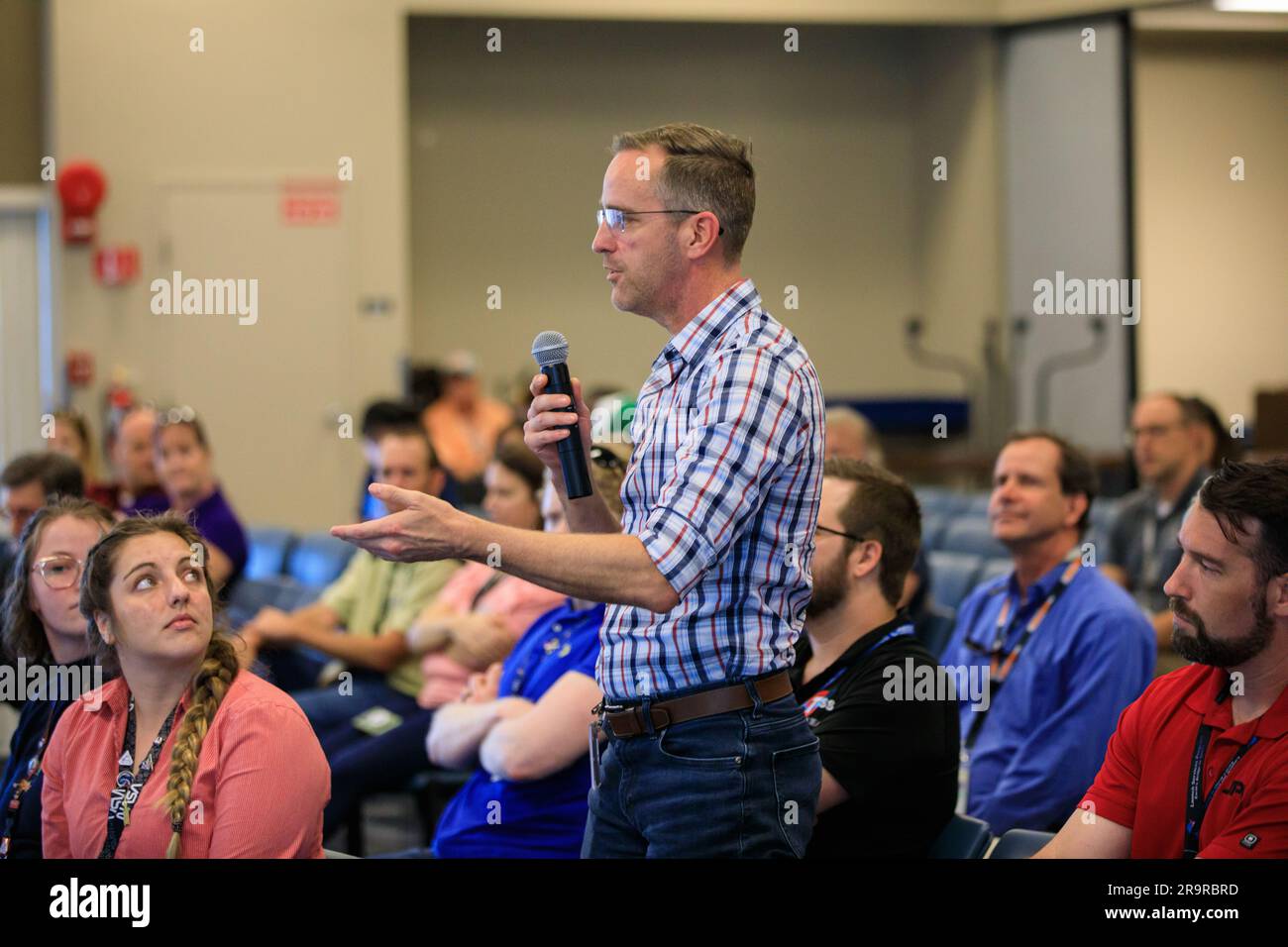 Cross-Program Connection Event. An audience member asks a question ...