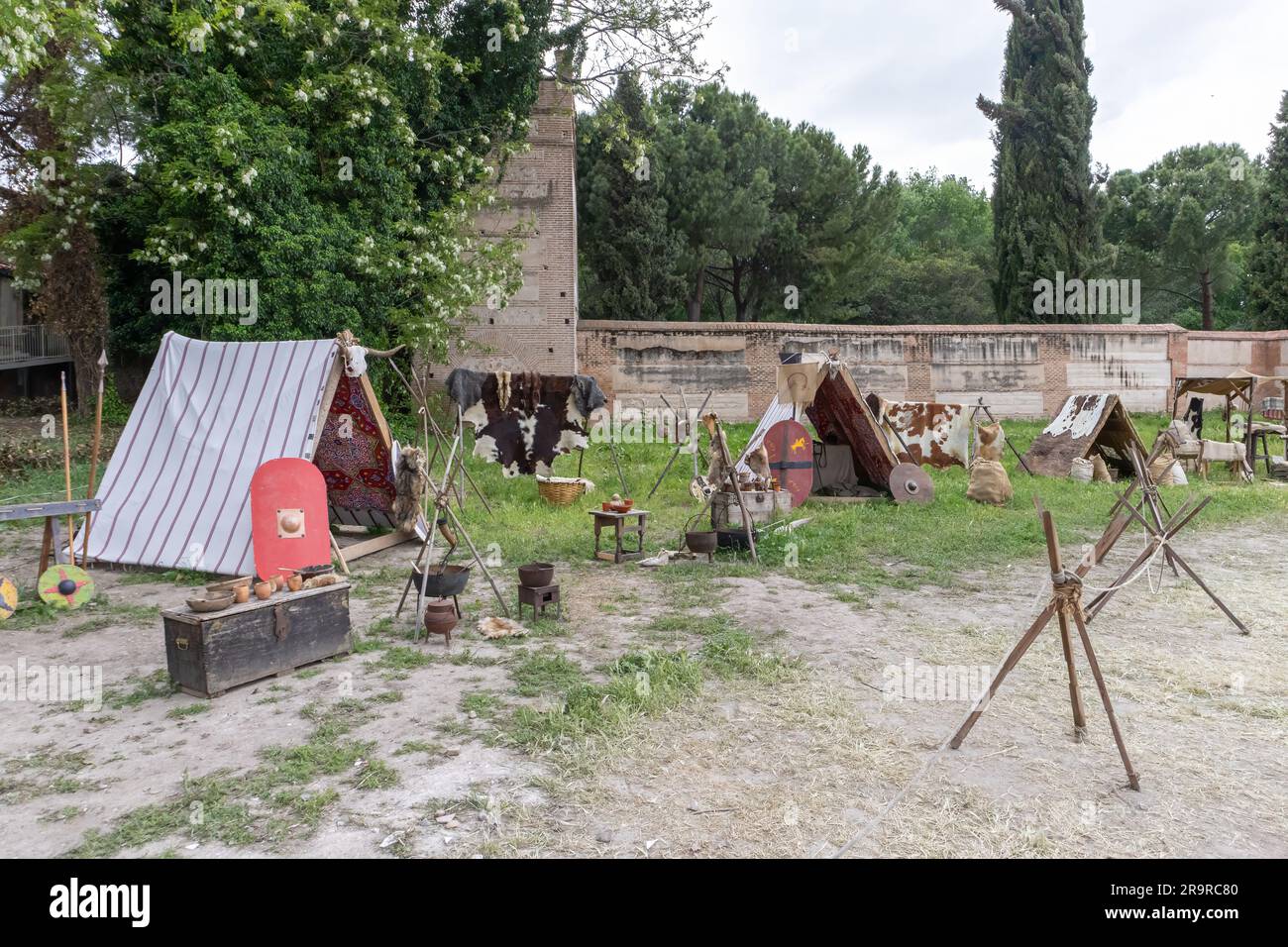 outdoor scene in horizontal view of the recreation of a military camp ...