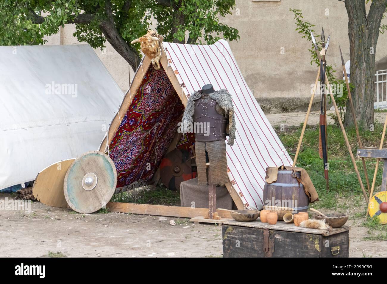 outdoor scene in horizontal view of the recreation of a military camp ...