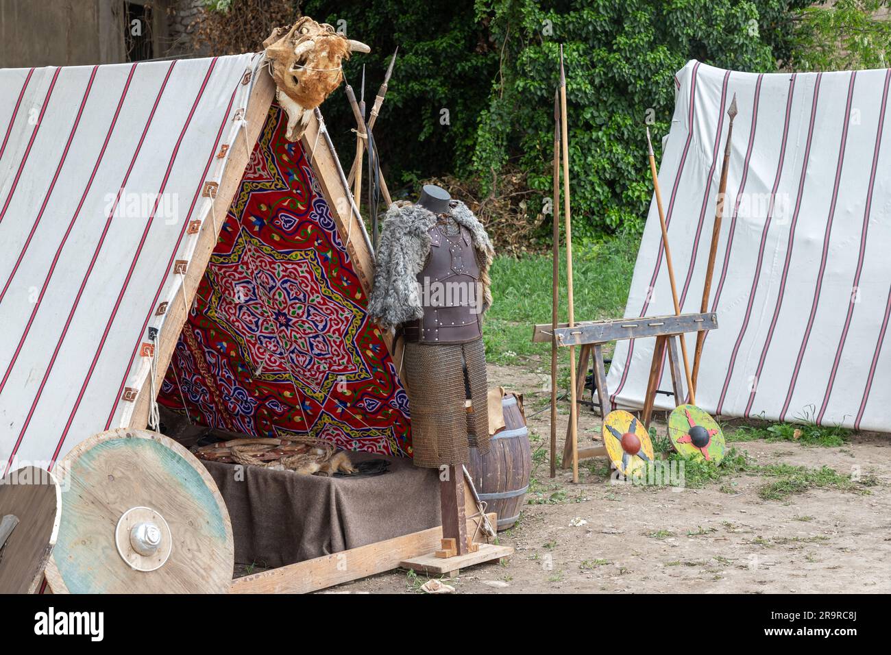 outdoor scene in horizontal view of the recreation of a military camp ...