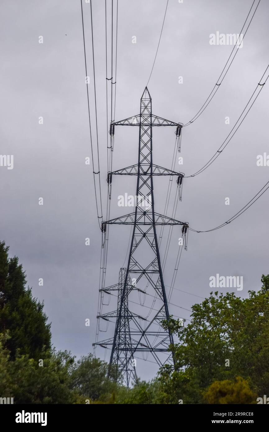 London, UK. 28th June 2023. An electricity transmission tower, also ...