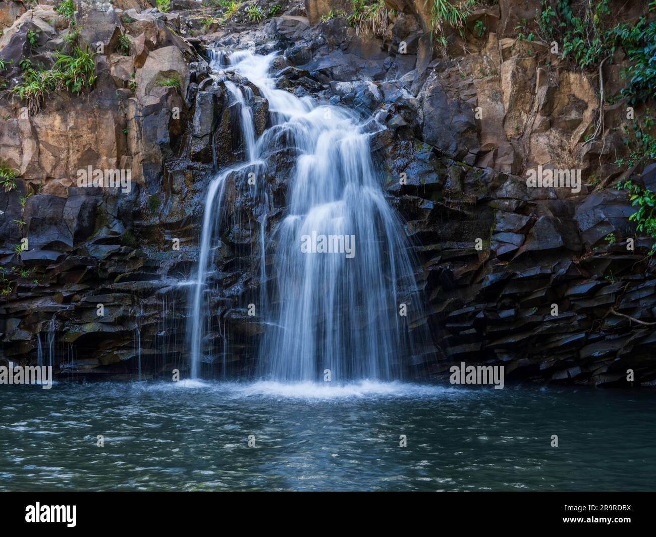 A gorgeous waterfall on the island of Maui takes many steps as it ...