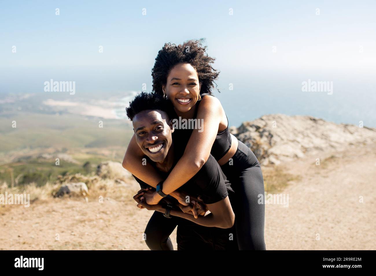 Excited african american couple resting during workout outdoors on ...