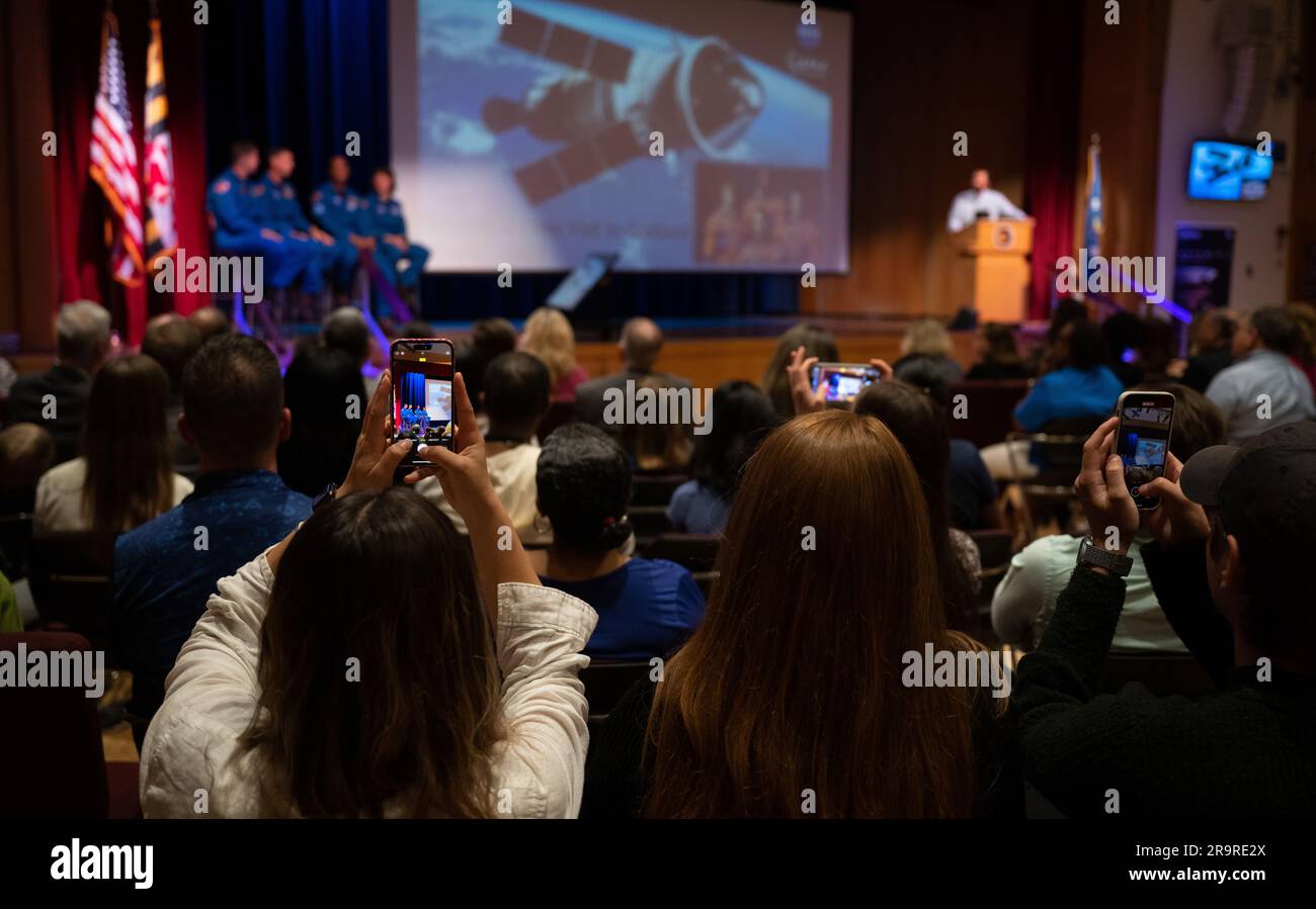 Artemis II Crew at GSFC. Members of the audience take pictures and ...