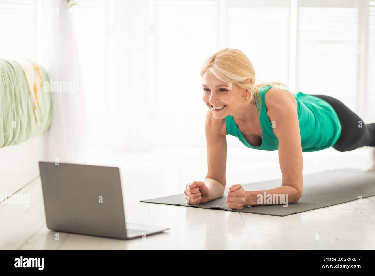 Domestic Training. Sporty Senior Woman Making Plank Exersise In Front ...