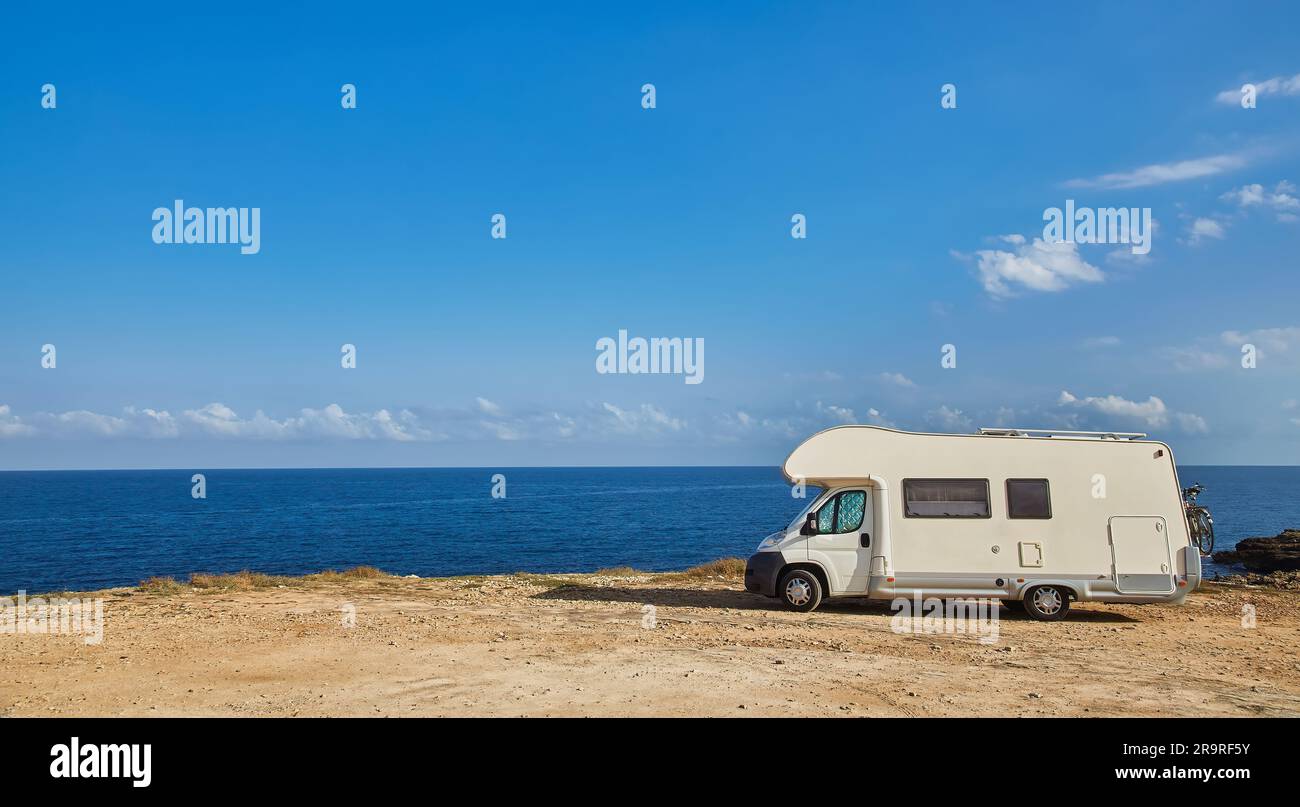 Camper rv caravan on mediterranean coast in Italy. Wild camping on sea ...