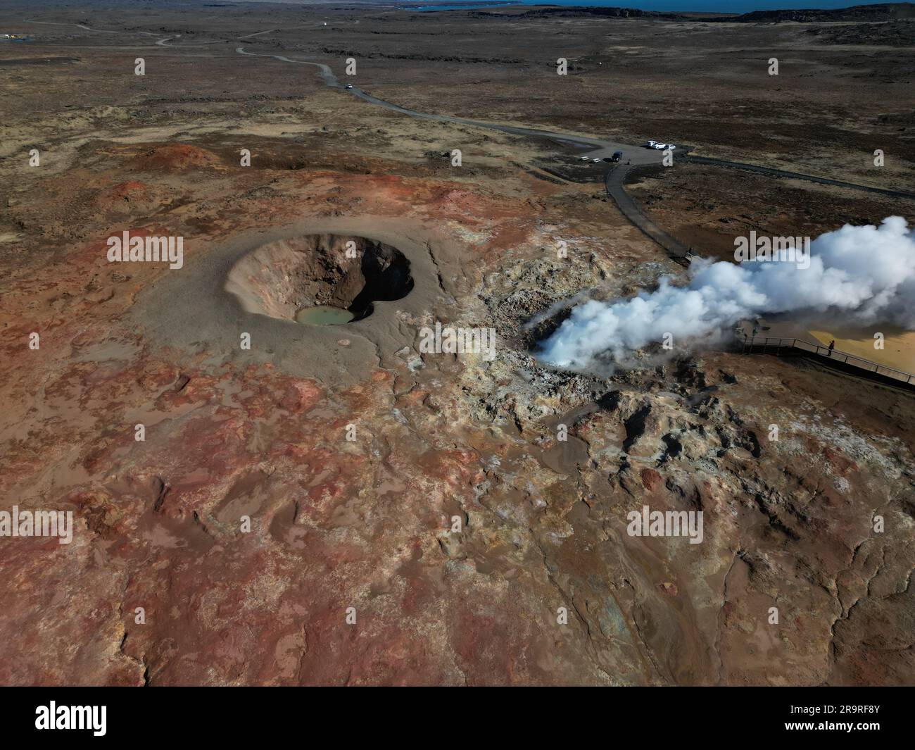An aerial view of a sulphuric vent in Iceland, with steam rising from ...