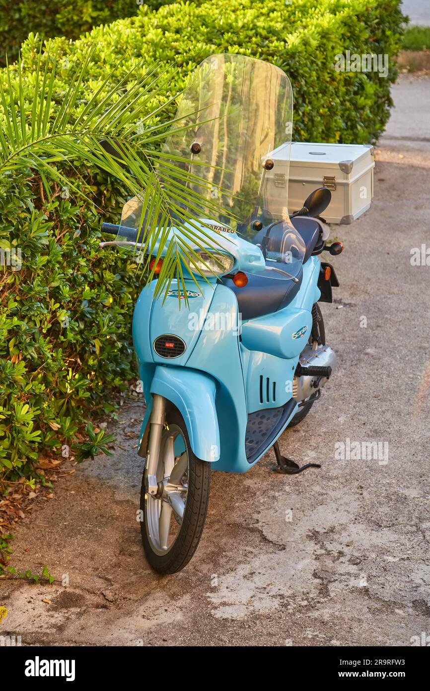 a beautiful retro moped parked on the street of the old town Stock ...