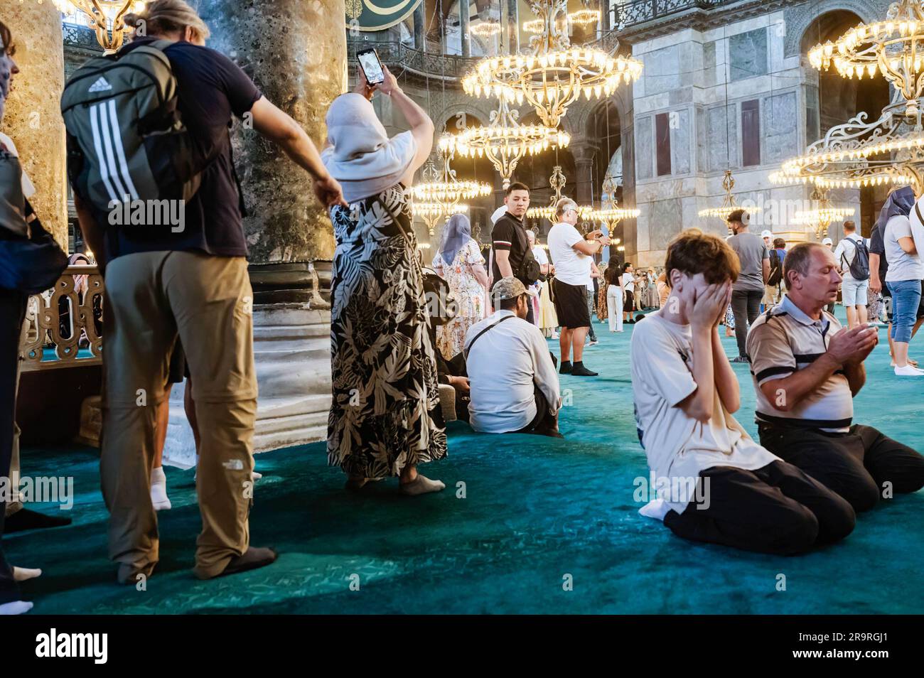 Istanbul, Turkey. 28th June, 2023. A father and a son seen praying ...