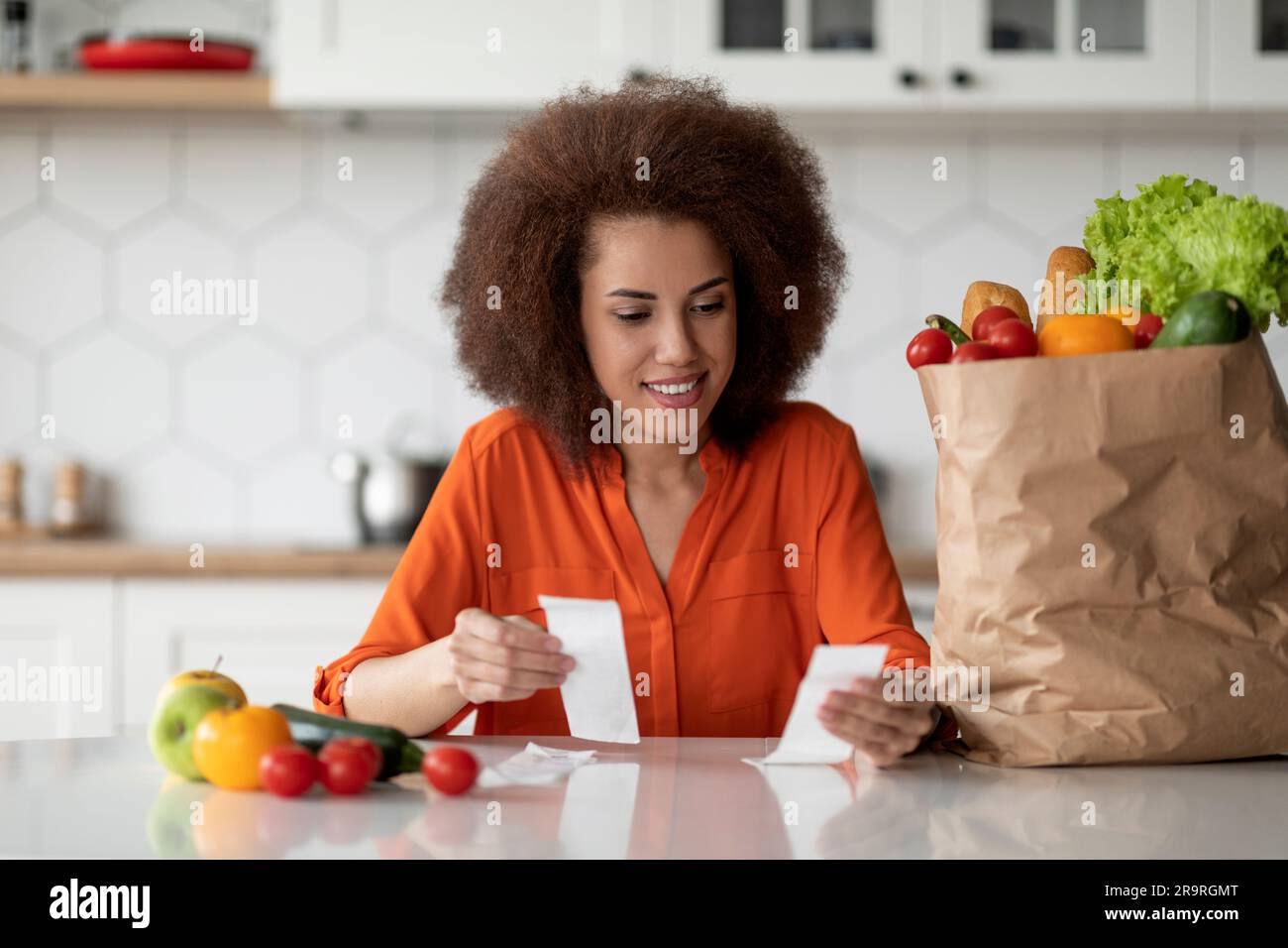 Market Delivery. Happy Black Lady Checking Bills In Kitchen After ...