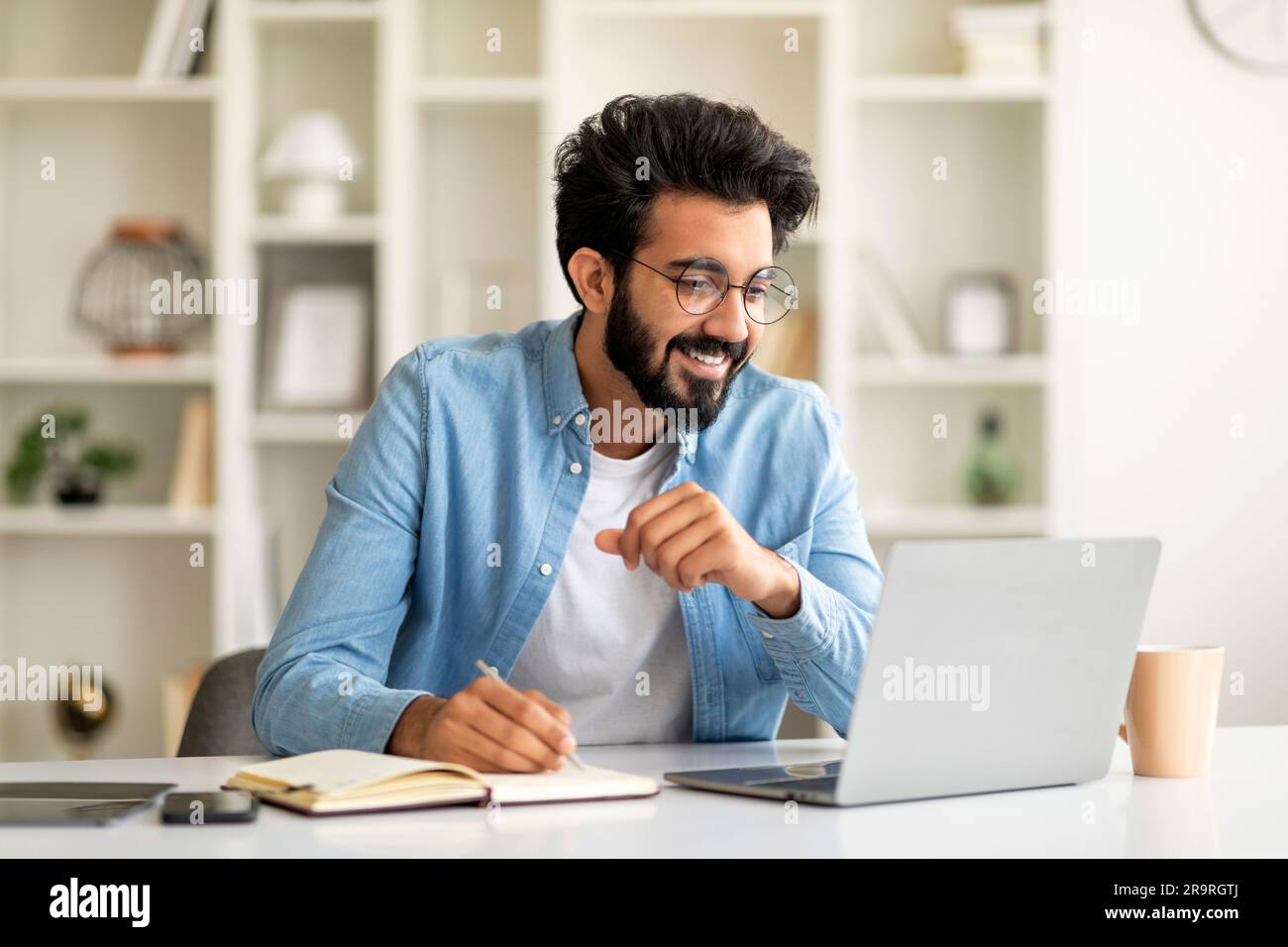 Online Education. Young Indian Man Watching Webinar On Laptop And ...