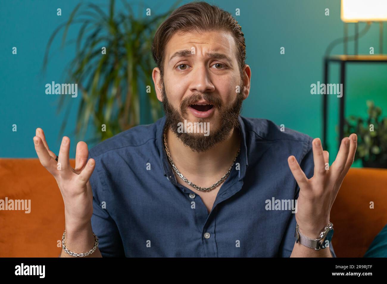 What. Why. Lebanese man raising hands in indignant expression asking ...