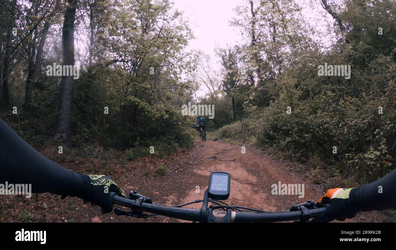Riding a mountain bike from rider point of view on the handlebar on a ...