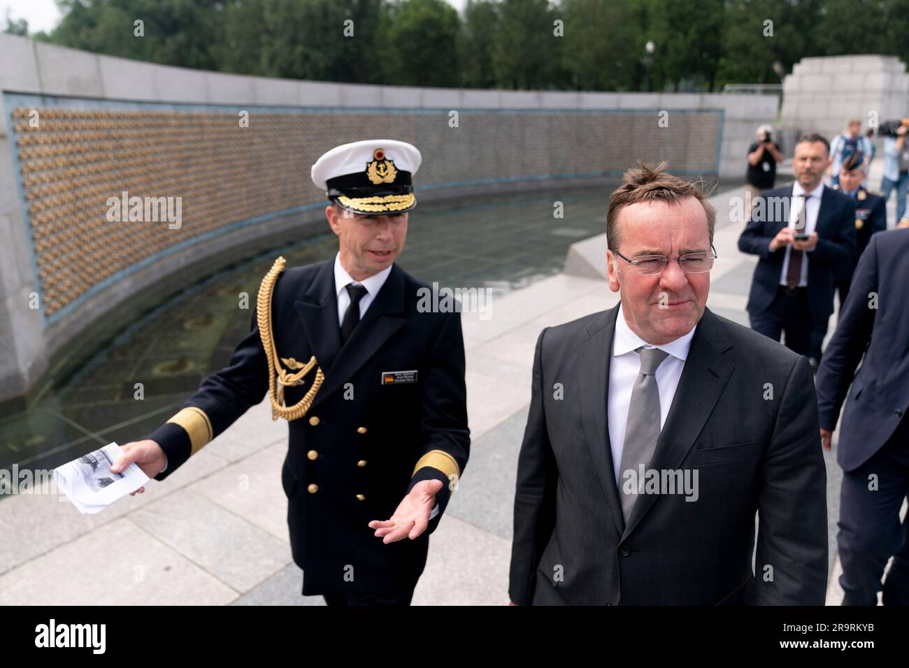 German Navy Rear Admiral Axel Ristau, left, speaks with German Defense ...