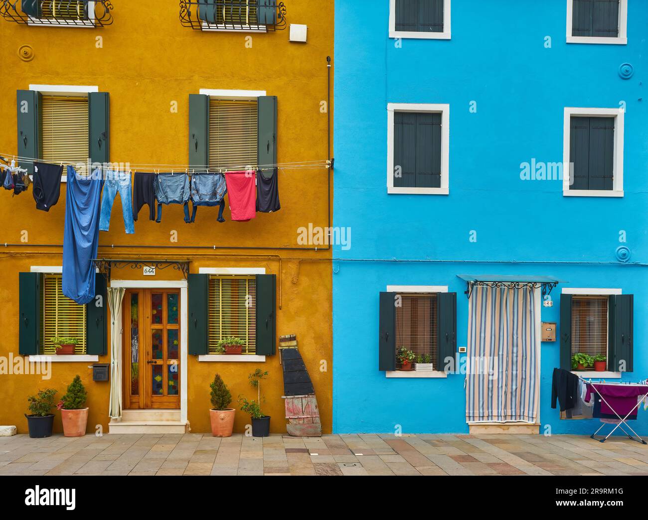 Beautiful colorful house facade on Burano island, north Italy. Half ...